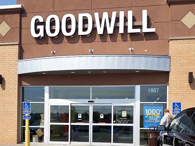 The classic Goodwill entrance stands like a portal to possibility, where yesterday's castoffs become tomorrow's treasures.
