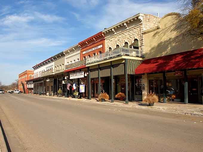 These limestone storefronts with their covered walkways were built when people actually cared about keeping shoppers comfortable and cool.