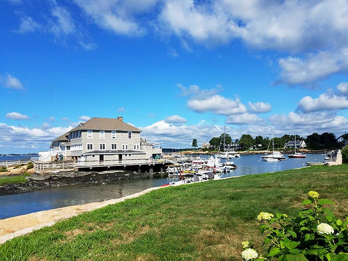 Sailboats bobbing in the harbor while waterfront homes bask in sunshine—coastal living done right here.