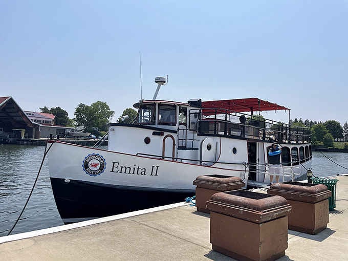 The Emita II waits patiently at the dock, ready to carry passengers on journeys through scenic waterways and memories.