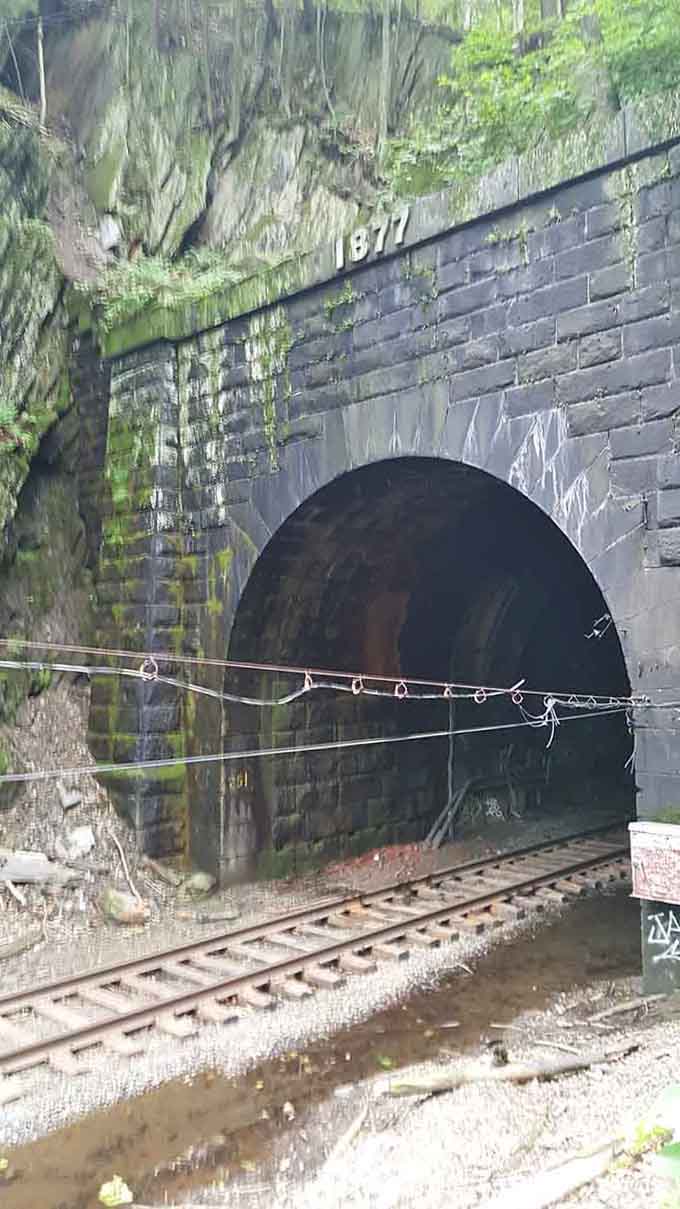 The 1877 date carved above tells you this engineering marvel has been collecting ghost stories for generations.