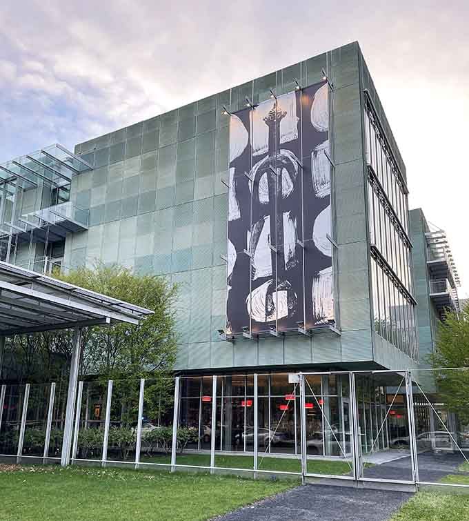 That dramatic artwork on glass panels adds an unexpected artistic punch to the sleek exterior.