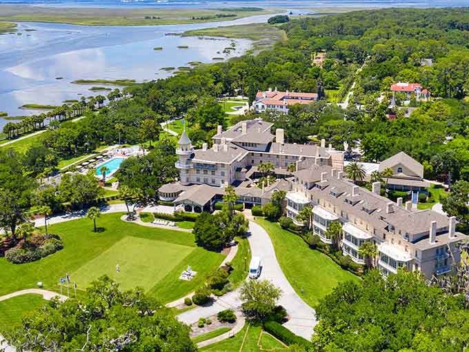 Where Gilded Age millionaires once vacationed, grand estates still stand among ancient oaks draped in silvery Spanish moss.