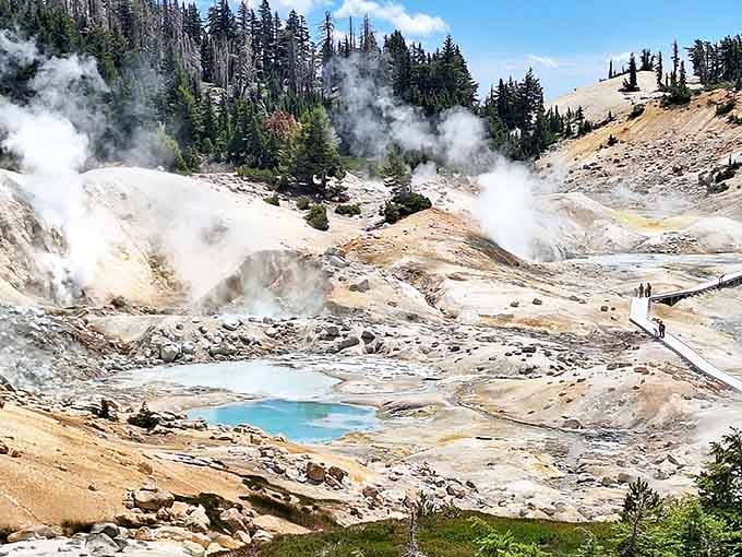 Steam rises from bubbling turquoise pools where the earth's inner artist paints with sulfur yellows and iron reds.