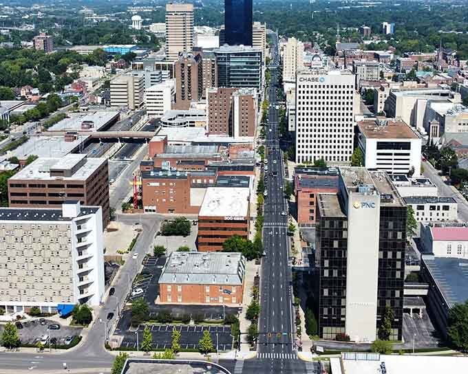 From above, the city reveals its perfect blend of historic charm and modern energy stretching toward green horizons.