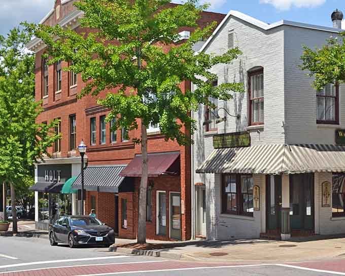 Striped awnings and brick sidewalks create the kind of street where neighbors still stop to chat.