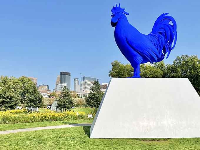 That bold blue rooster commands attention against the skyline, strutting its stuff with unapologetic confidence.