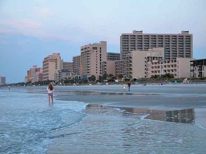 Soft daylight surrounds the beachfront hotels where generations have built sandcastles and memories that stand the test of time.
