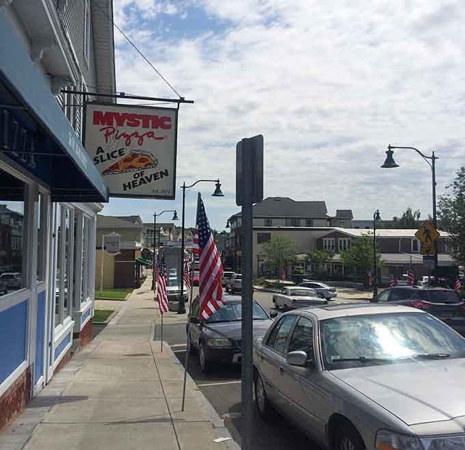Downtown Mystic stretches along the street with flags flying and pizza calling your name from every corner.