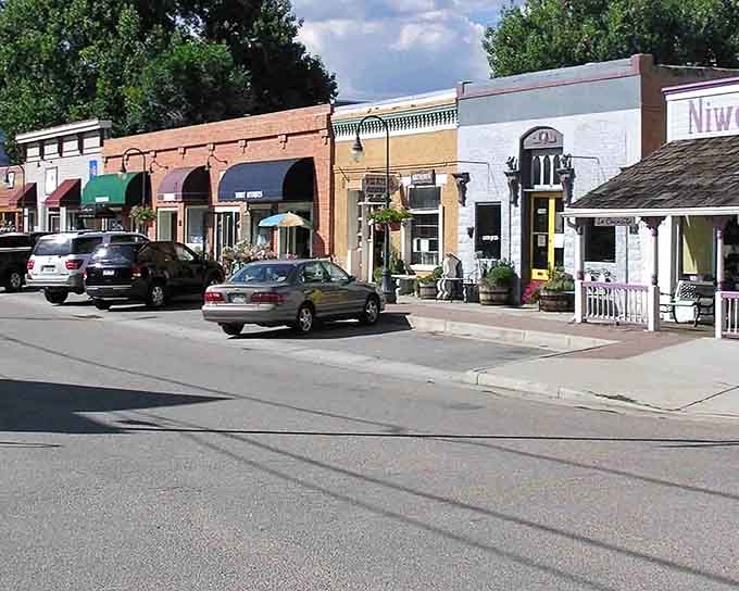 Historic buildings wear their age gracefully, each colorful awning inviting you to explore local shops.