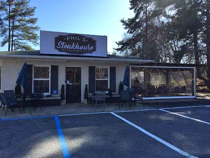 The covered patio whispers "stay awhile" while that vintage sign promises meals worth remembering for years.