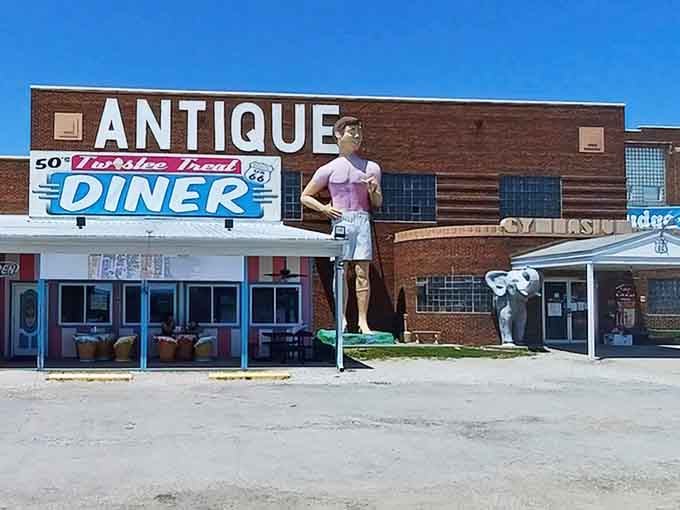 That giant pink waitress statue towers over Route 66 like a friendly guardian of nostalgia and treasures.