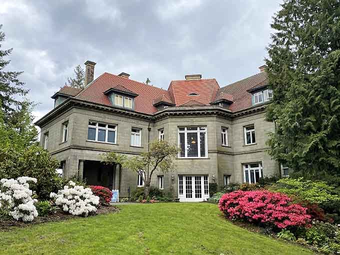 Those blooming azaleas frame the mansion's backyard like nature's own welcome mat, pink and white and absolutely stunning.