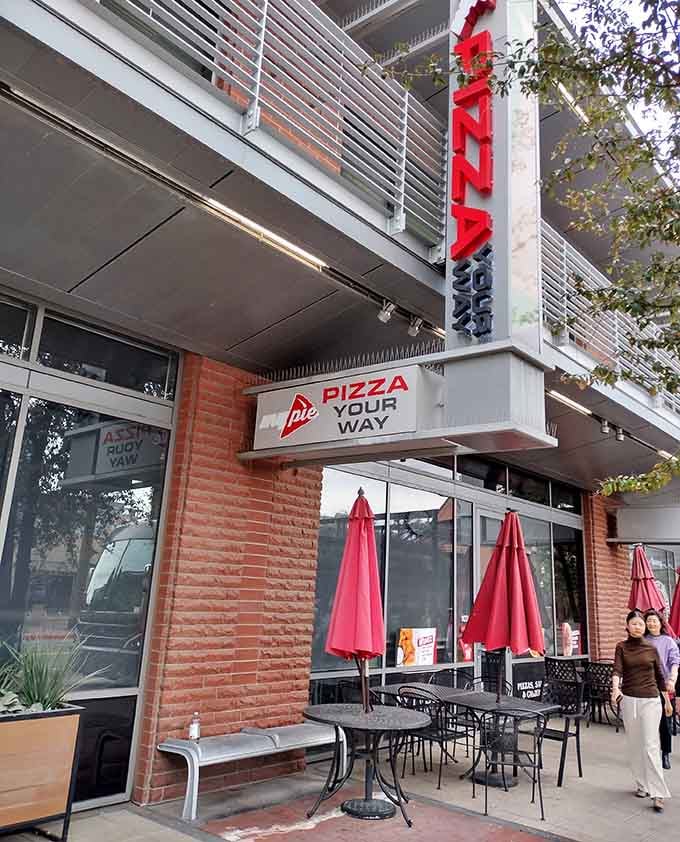 That vertical sign towers above the street like a beacon guiding pizza pilgrims to their cheesy destination below.