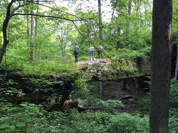 Hikers standing atop this natural rock span look tiny, proving that Illinois has some serious geological bragging rights.