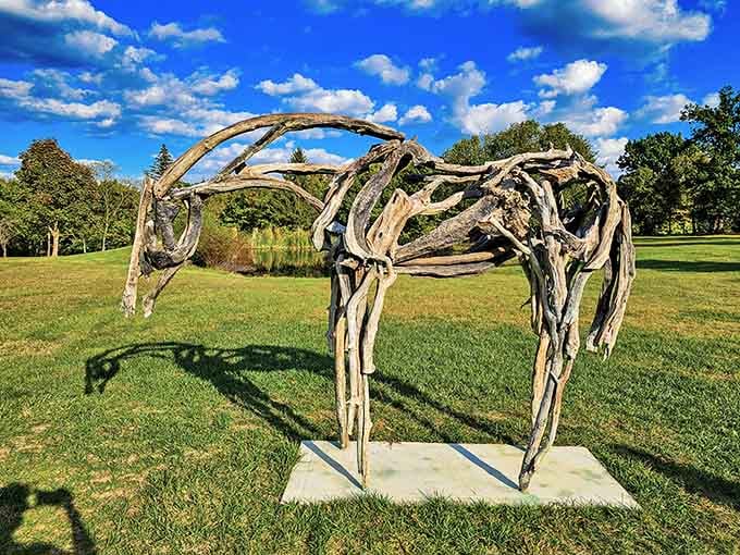 This graceful driftwood horse looks ready to gallop across the sculpture park under brilliant blue skies and puffy clouds.