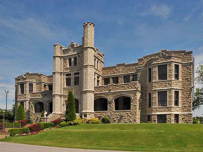 The manicured lawn and stone towers create a fairy tale setting with decidedly un-Disney-like ghost stories within.