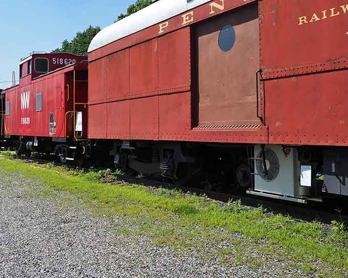 Weathered red paint and sturdy construction tell stories of countless miles hauling freight across America's heartland through every season.