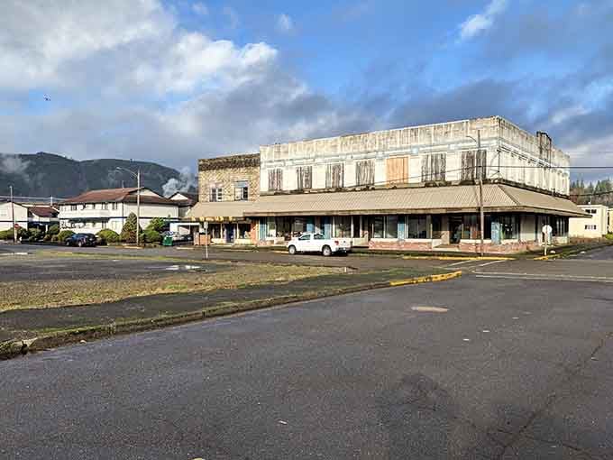 Dramatic skies frame this weathered beauty like nature's own spotlight on authentic small-town character and resilience.