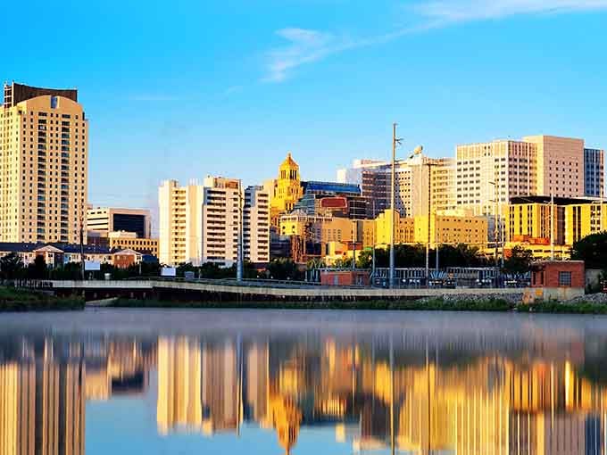Golden hour paints the buildings in warm light while the river mirrors every detail like nature's own photograph.