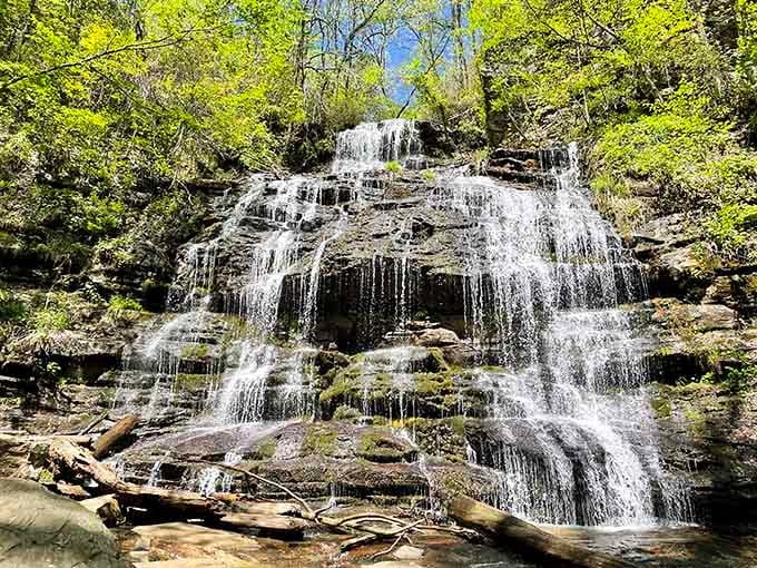 Water cascades down layered rocks in delicate ribbons, creating a natural masterpiece that photographs can't quite capture.