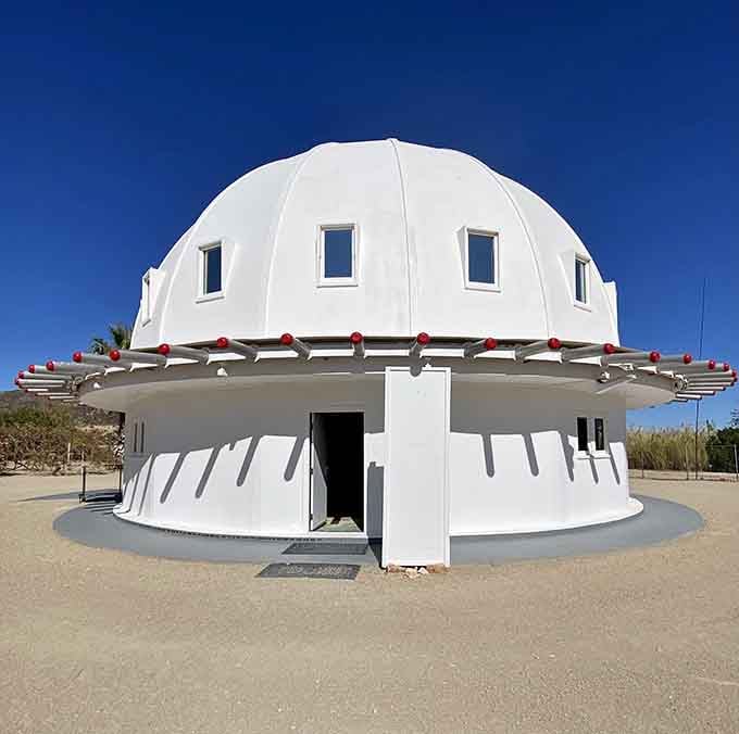 Under blue skies, the Integratron gleams like a giant's mixing bowl turned upside down in the sand.