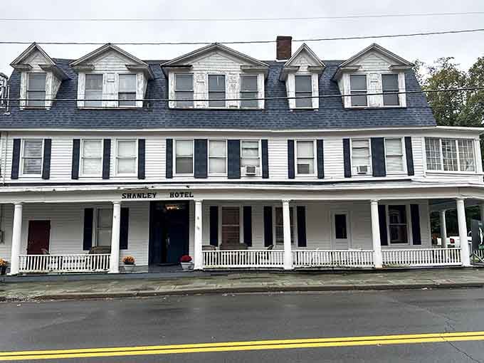 Five dormers peer down from the roofline like curious eyes watching Main Street for over a hundred years.