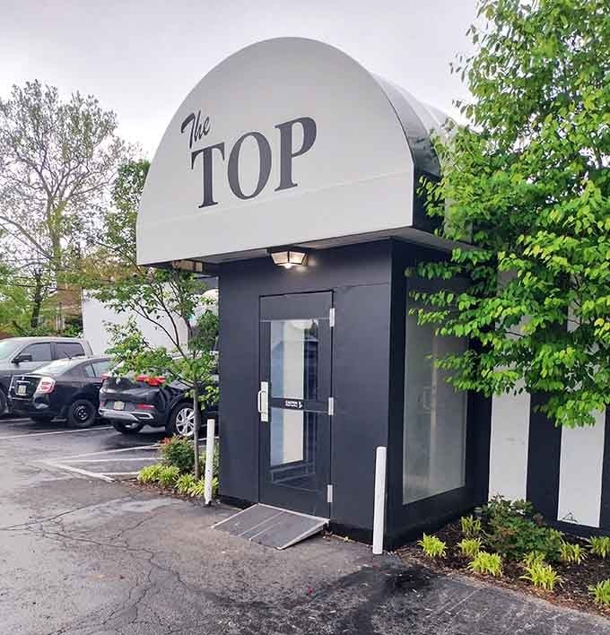 Surrounded by greenery and bathed in golden light, this iconic dome entrance whispers "legendary steaks await" to those who know.