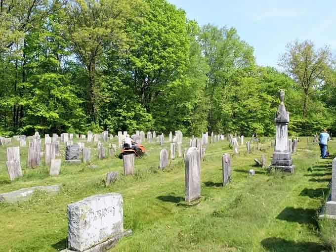 Tilted markers and bright green grass create a surprisingly serene setting for one of Connecticut's most legendary haunted spots.