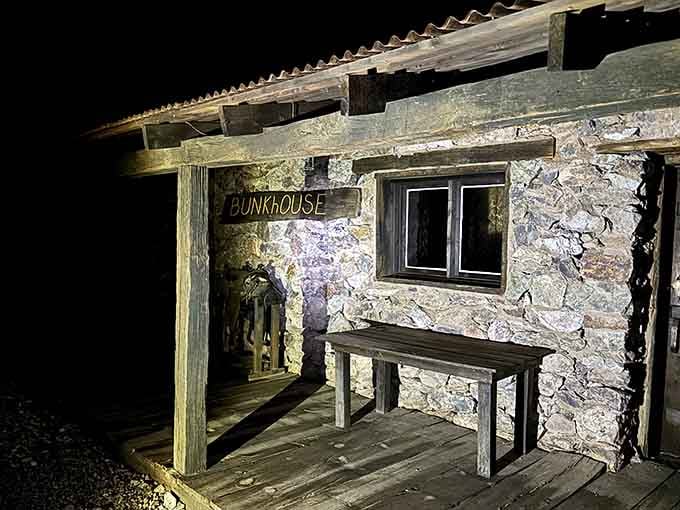 That lonely bunkhouse bench waits under sagging timbers where gold miners once rested their weary bones after long shifts.
