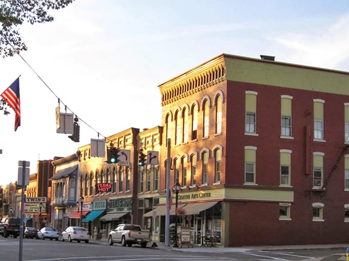 Golden afternoon light bathes these classic storefronts, turning an ordinary street into something worthy of a Norman Rockwell painting.