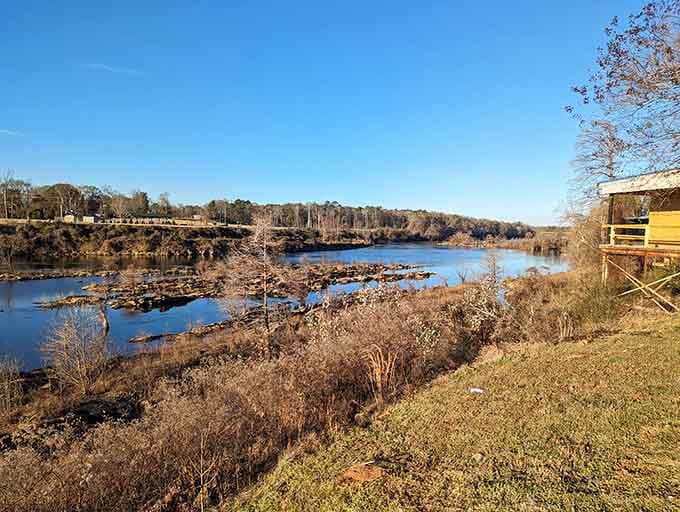 The crater's peaceful landscape today hides its explosive cosmic origins, visible in the jumbled rock layers along the riverbank.