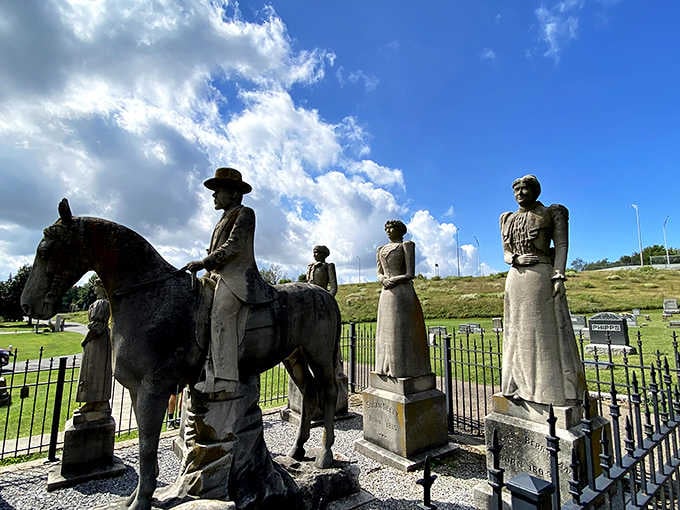 The mounted horseman surveys his domain alongside his beloved hunting companions, frozen forever in Victorian grandeur and devotion.