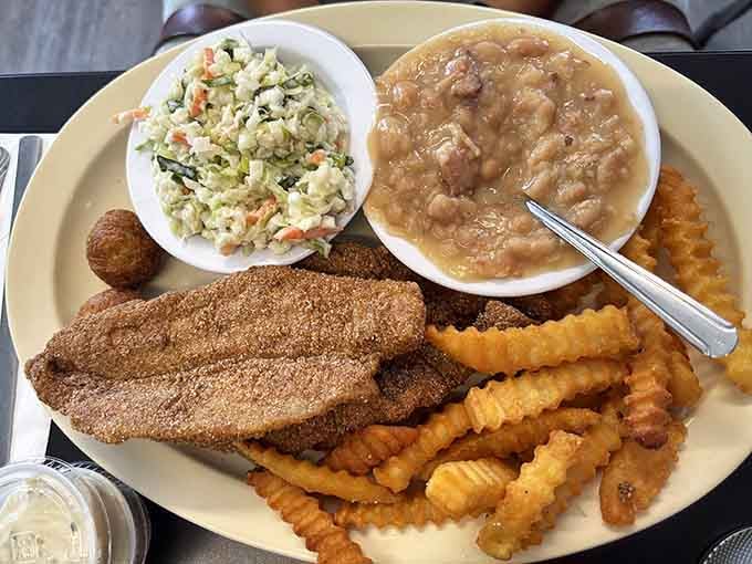 Crispy catfish paired with waffle fries and sides proves lunch here is just as impressive as breakfast.