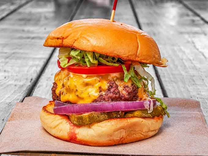 This burger looks like it just walked off the set of a food commercial, except it's real and it's spectacular.