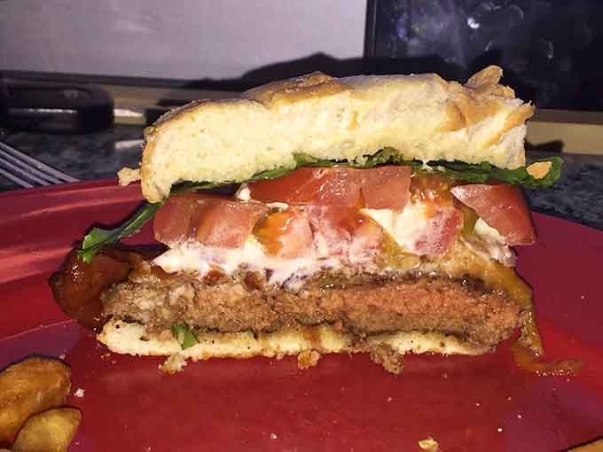 This towering burger situation looks like it requires an engineering degree and serious appetite to tackle properly.