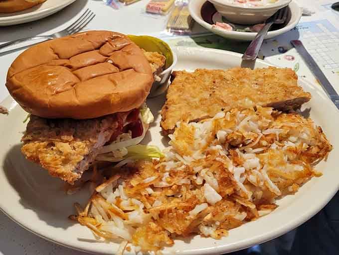 Golden hashbrowns meet a pork tenderloin sandwich in what can only be described as a carbohydrate love story.