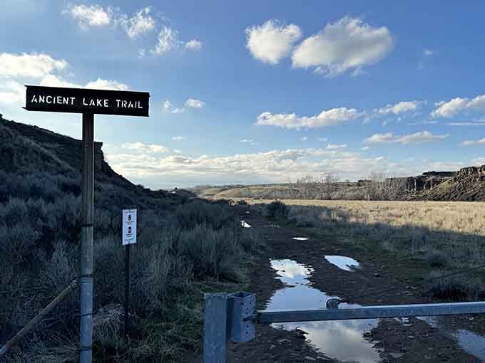 This unassuming trailhead sign is basically the wardrobe to Narnia, except instead of snow you'll find lakes.