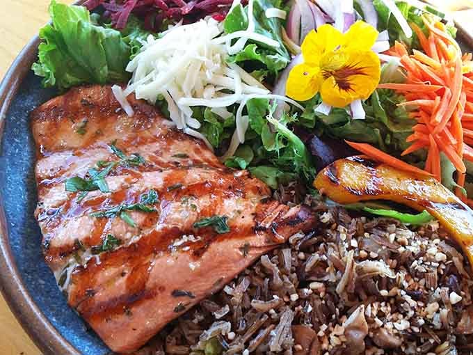 Maple-glazed salmon with wild rice and fresh greens, proof that Minnesota knows how to treat its fish with proper respect.