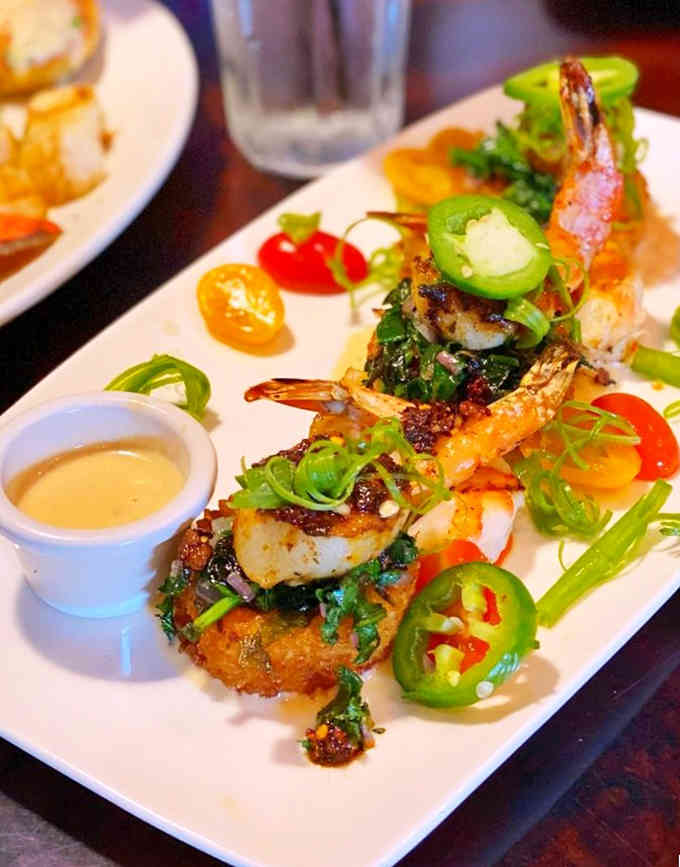 These beautifully plated shrimp arrive looking like edible art, complete with jalape&ntilde;o garnish and vibrant presentation.