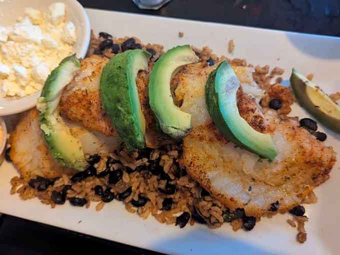 Blackened cod topped with fresh avocado proves that surf meets California in the best possible way.