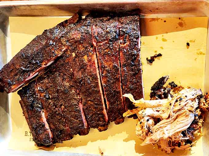 When ribs and pulled pork share a tray, it's less a meal and more a barbecue summit meeting.