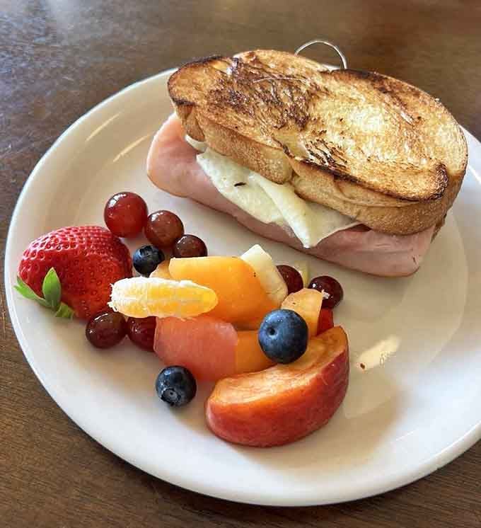 This breakfast sandwich comes with a fruit side that almost makes you feel virtuous about your choices.