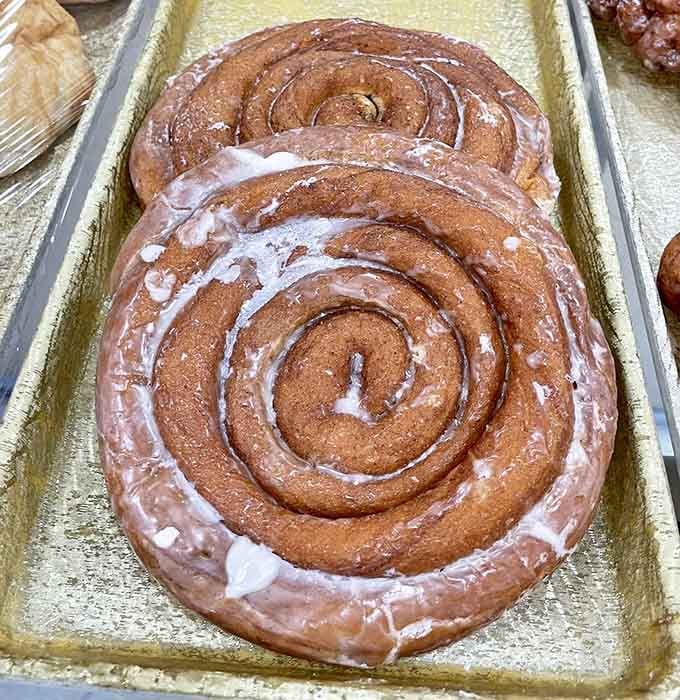 That cinnamon roll could double as a throw pillow, and honestly, you'd be tempted to nap on it before eating it.