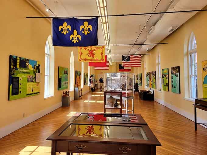 Historic flags hanging from the ceiling tell stories spanning centuries, making history feel less like homework and more like discovery.