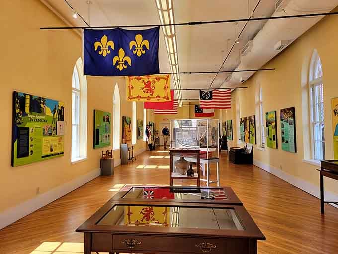 Inside the History Museum, flags and exhibits tell stories that actually happened here, not in some Hollywood version of history.