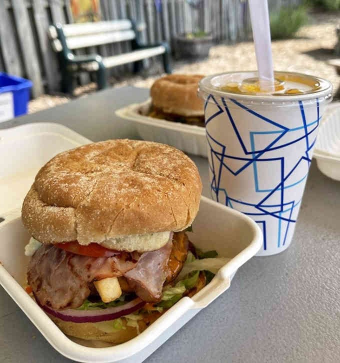 The Cajun bleu burger stacked high with fresh toppings shows they're not messing around with portion sizes here.