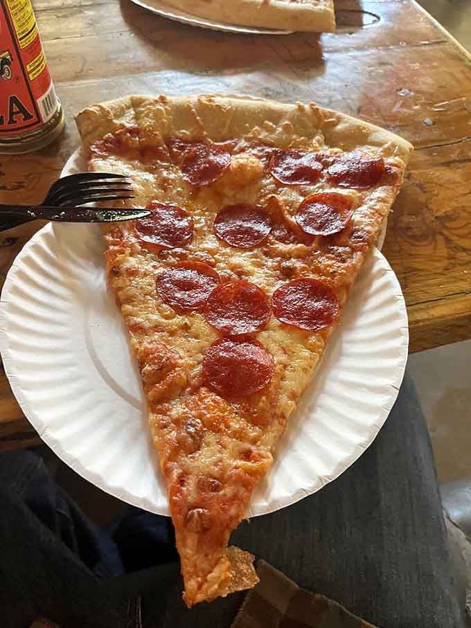Behold: a single slice of pepperoni pizza that could serve as a personal flotation device in emergencies.