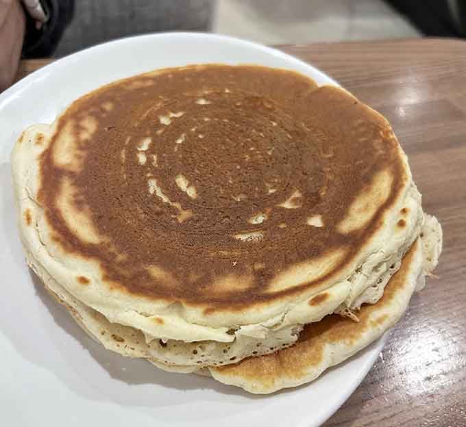 Golden, fluffy, and stacked like edible architecture, these pancakes understand the assignment and then some.