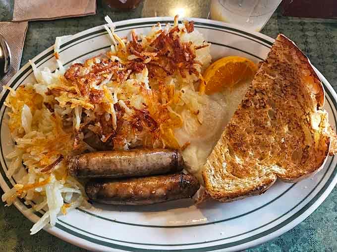 Golden hashbrowns, perfectly cooked eggs, and sausage links create a breakfast symphony that deserves a standing ovation every time.